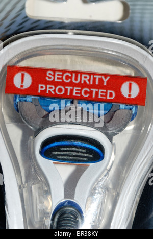 Close-up retail loss-prevention sign warning that shoplifting and ...