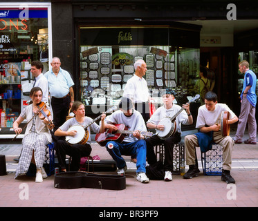 Irish buskers, Grafton St., Dublin. Playing guitar, double bass Stock ...