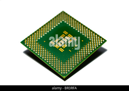Microprocessor on white background. golden pins facing up. The concept ...