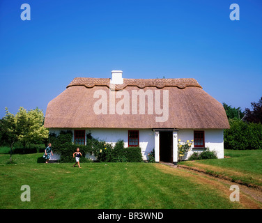 Puckane (Puckaun), Co Tipperary, Ireland, Family Outside Cottage Stock ...
