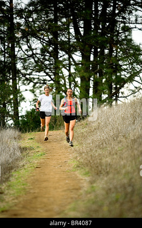 Two women trail running together Stock Photo - Alamy