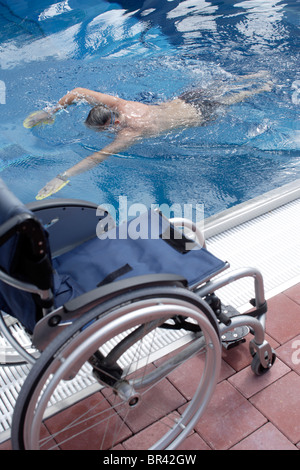 wheelchair for the disabled for use in swimming pool Stock Photo - Alamy