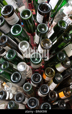 Empty wine bottles on a rack Stock Photo - Alamy