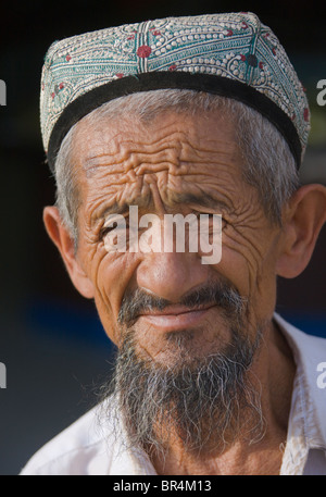 Portrait of elderly man with beard of the Uighur tribe in Kashgar ...
