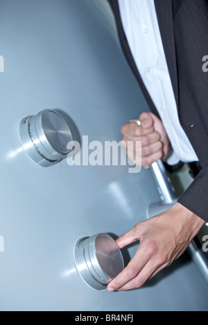Man opening vault, close-up Stock Photo - Alamy