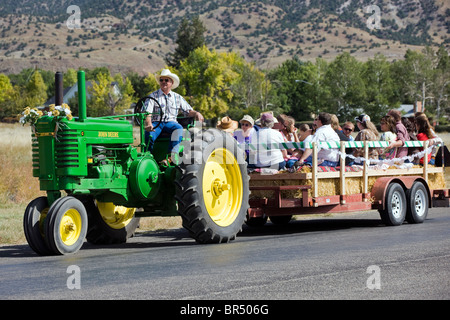 Wedding procession, ranch family riding on antique tractors from the ...