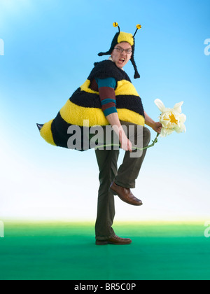 Man in humorous bee costume Stock Photo - Alamy