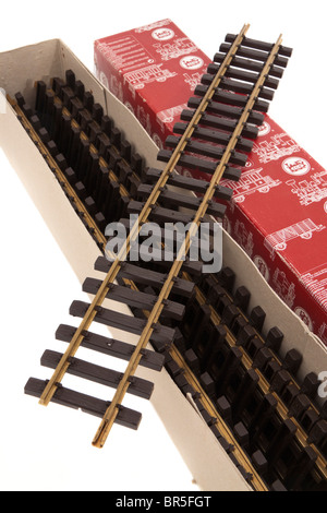 A large long train on a train track with trees in the ...