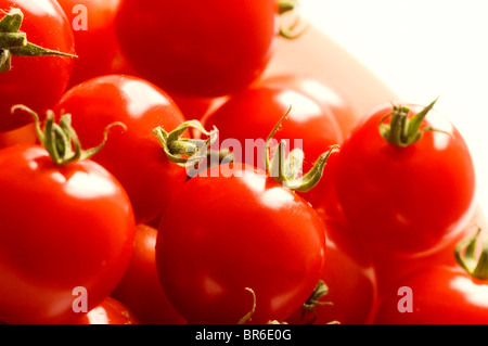 Fresh organic cherry tomatoes on wooden table Stock Photo - Alamy