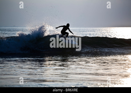 A Young man surfing a 4ft wave Stock Photo - Alamy
