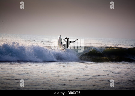 A Young man surfing a 4ft wave Stock Photo - Alamy