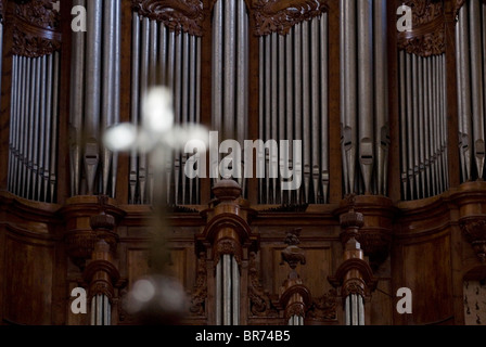 Cross infront of a large organ in Saint Maximin France Stock Photo - Alamy