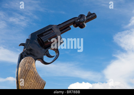 Sculpture of a gun with a twisted barrel tied in a knot on the Victoria ...