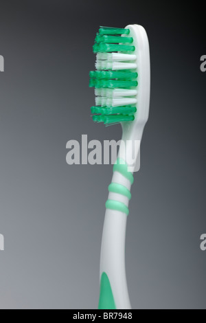 Green Toothbrush on a white background Stock Photo - Alamy