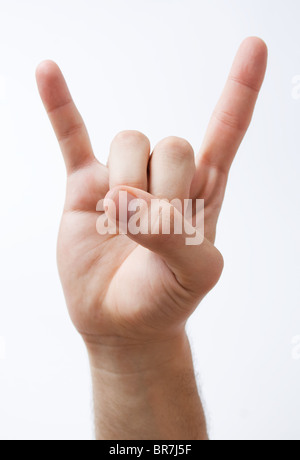 Male hand and fingers showing heavy metal rock-n-roll sign, isolated on ...