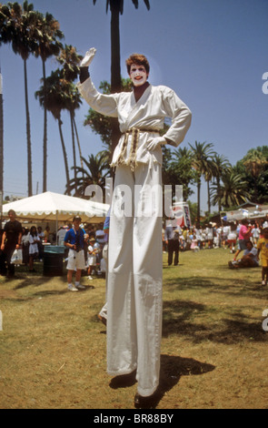 mime stilts tall carnival fun event fair perform thrill tall clown act ...