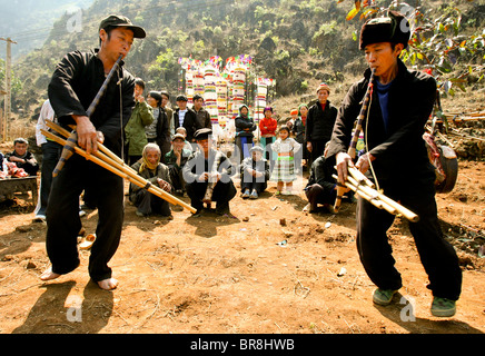 Hmong hill tribe men playing top spinning competition (traditional game ...