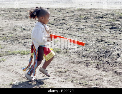 USA, North Carolina, Cherokee. Young Cherokee boy dressed in a ...