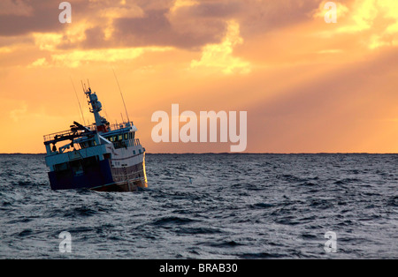 Fishing boat / Trawler on the North Sea dragging fishing nets Stock ...