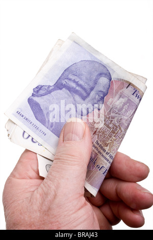 Cash in hand - bundle of sterling notes held in a hand UK money Stock ...