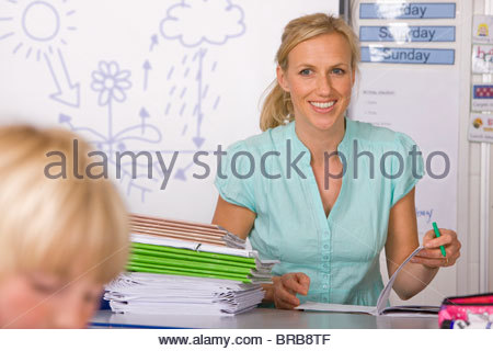 Teacher Marking Books Stock Photo: 36928504 - Alamy