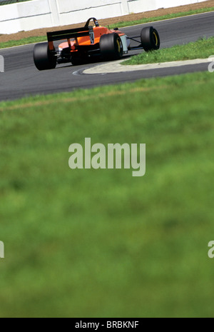 Formula one car driving around a corner Stock Photo - Alamy