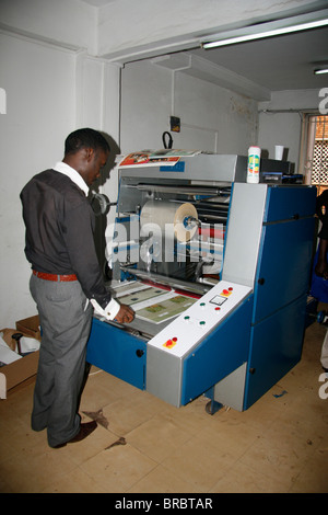 Plastic laminating machine Stock Photo - Alamy