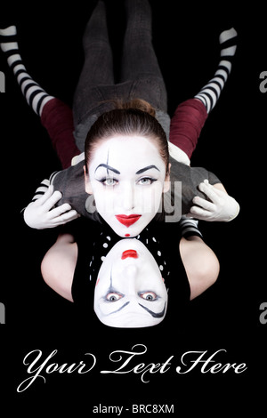 Portrait of two mimes on black background Stock Photo - Alamy