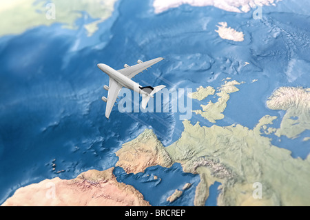 White Civil Airplane over the Atlantic ocean flying from Europe to the ...