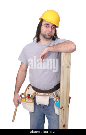 Hands holding construction tools on orange background Stock Photo - Alamy