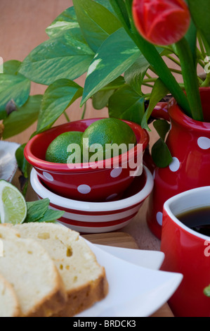 Lime in red bowl Stock Photo - Alamy