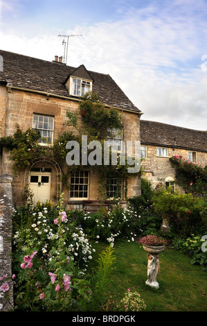 Country cottage with terrace and flowers Stock Photo - Alamy