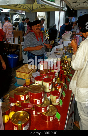 Shoppers buy pork meat at an outdoor state-run food market where a ...