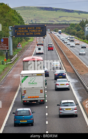 Busy motorway with gantry warning sign - M90 in Fife, Scotland near ...