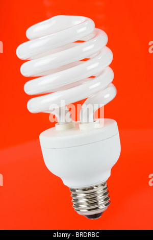 Compact Fluorescent Lightbulb with red background Stock Photo - Alamy