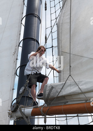 Sailor Folding Sail Stock Photo - Alamy
