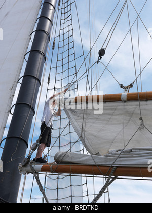 Sailor Folding Sail Stock Photo - Alamy