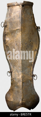 A Roman greave, 2nd/3rd century A.D. Essentially undecorated, brass ...