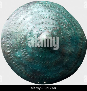 A decorative shield from the Ancient Near East, 9th/8th century B.C. A ...