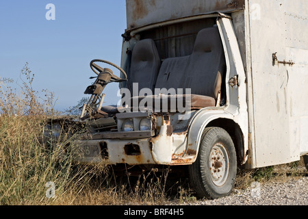 An old broken down Van left to rust on a dusty road in Cyprus Stock ...