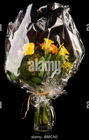 flower bouquet in cellophane packed Stock Photo - Alamy