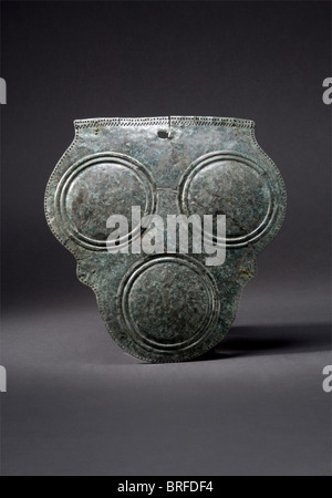 A set of Italic armour, 4th century B.C. A trefoil breastplate with ...