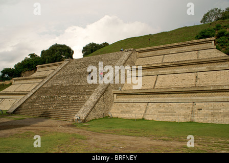 People climbing the reconstructed base of Tepanapa Pyramid's west side ...
