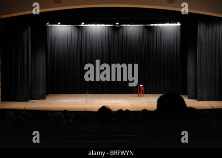 Empty theatre theater stage set up for a read-through with chairs only ...