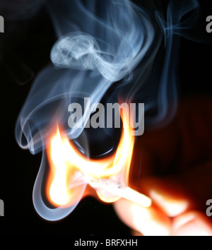 Head is flaring showing flame, on black background Stock Photo - Alamy