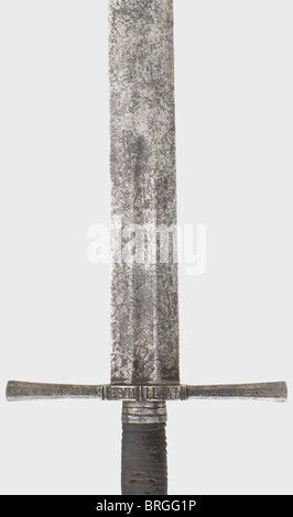 A German executioner's sword,dated 1692 Heavy,double-edged blade with ...