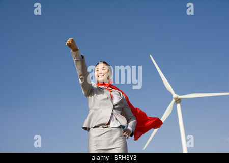Everyday hero in front of wind turbines Stock Photo - Alamy