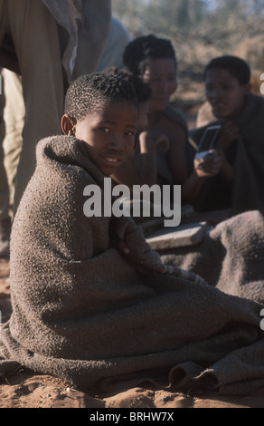 San Bushmen, Bushman group sitting around campfire, Kalahari, Namibia ...