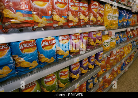Crisps displayed for sale on a supermarket shelf uk Stock Photo - Alamy