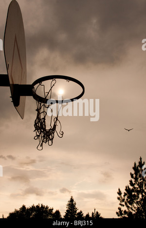 Playground basketball hoop with torn net Stock Photo - Alamy